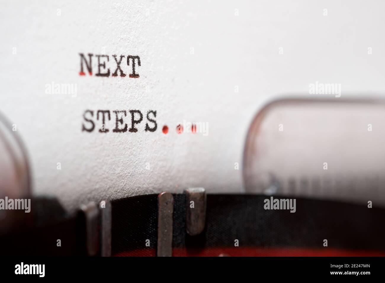 Next steps phrase written with a typewriter Stock Photo - Alamy