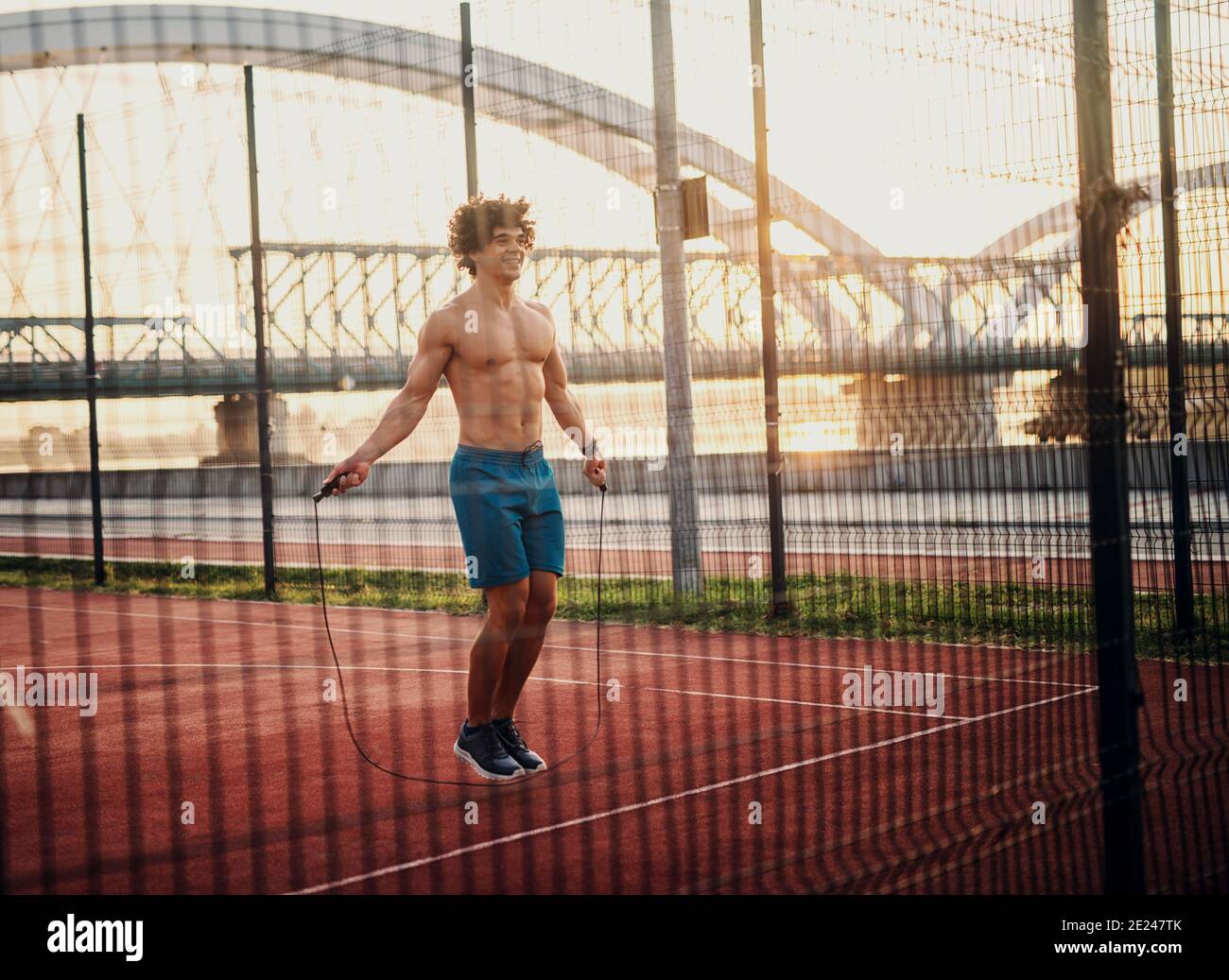 Strong man jumping rope in hi-res stock photography and images - Alamy