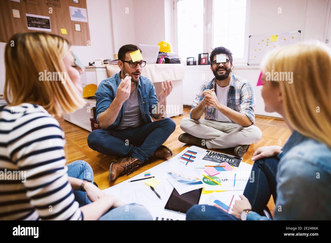Group of successful designers having team building session Stock Photo ...