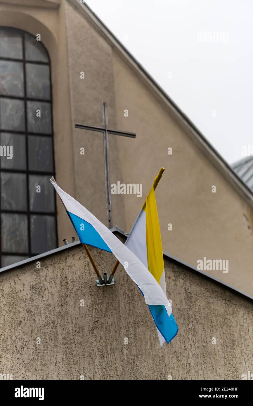 Flags on a church building Stock Photo - Alamy