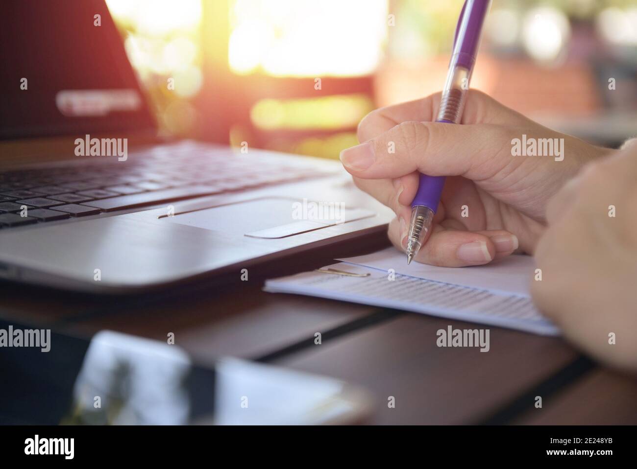 Close up hand write on paper work Stock Photo - Alamy