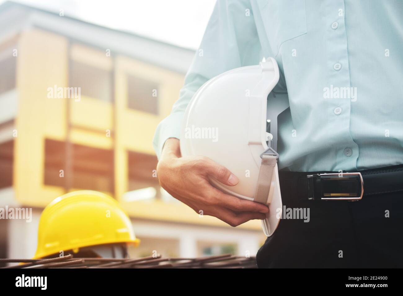 Technician holding white hat safety hard hat sunlight background Stock ...