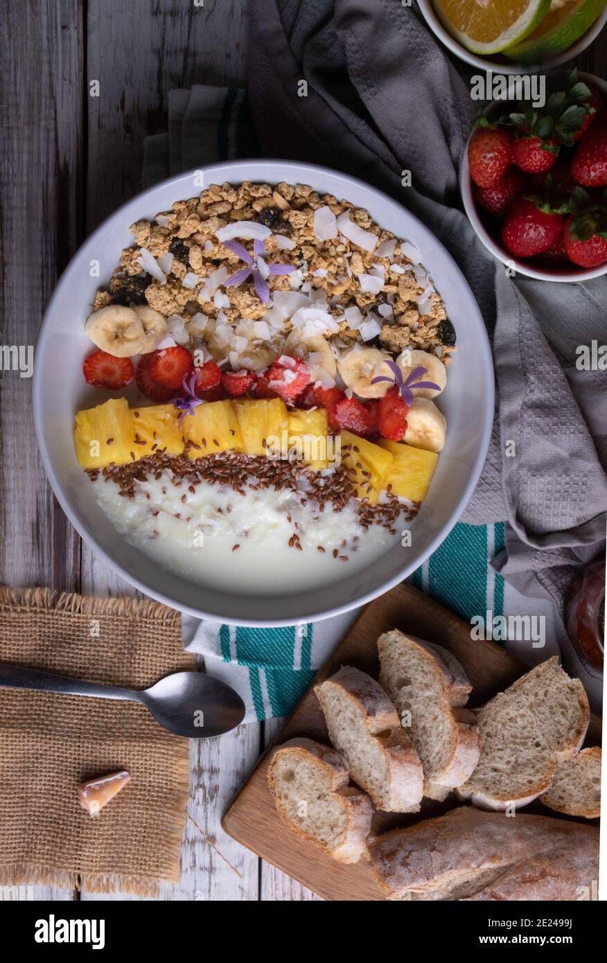 Vertical shot of healthy breakfast with oatmeal, pineapples ...