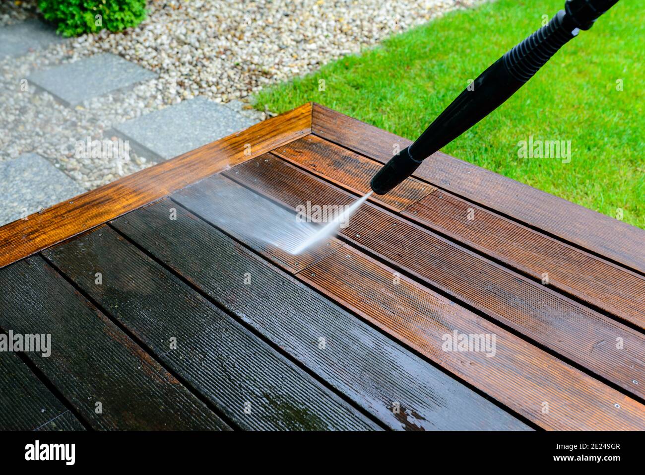cleaning terrace with a power washer - high water pressure cleaner on ...
