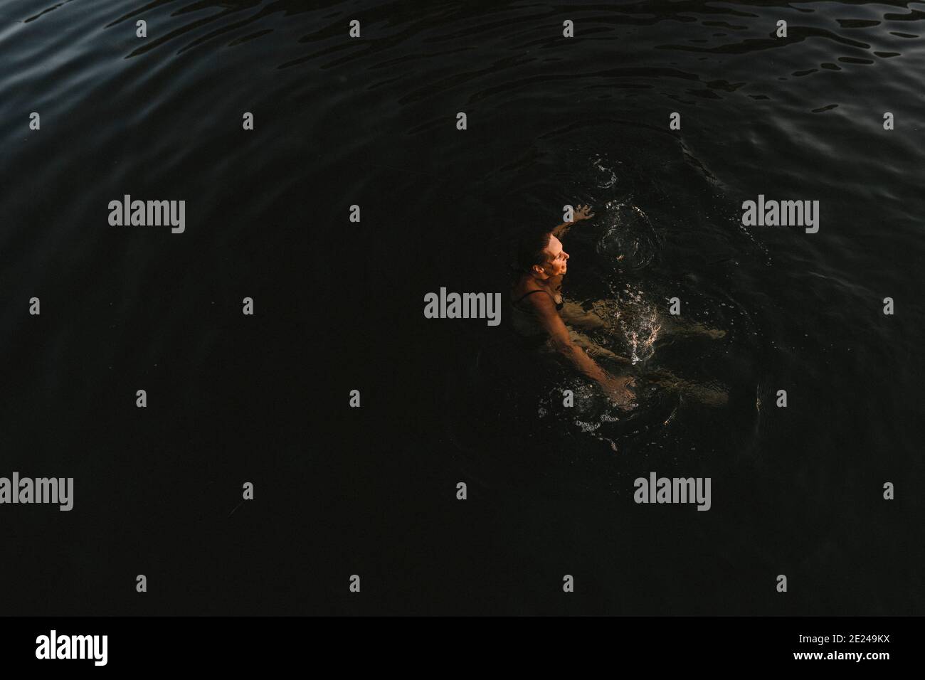 High angle view of woman swimming Stock Photo - Alamy