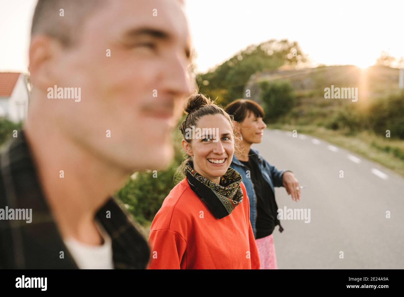 Woman standing roadside hi-res stock photography and images - Alamy