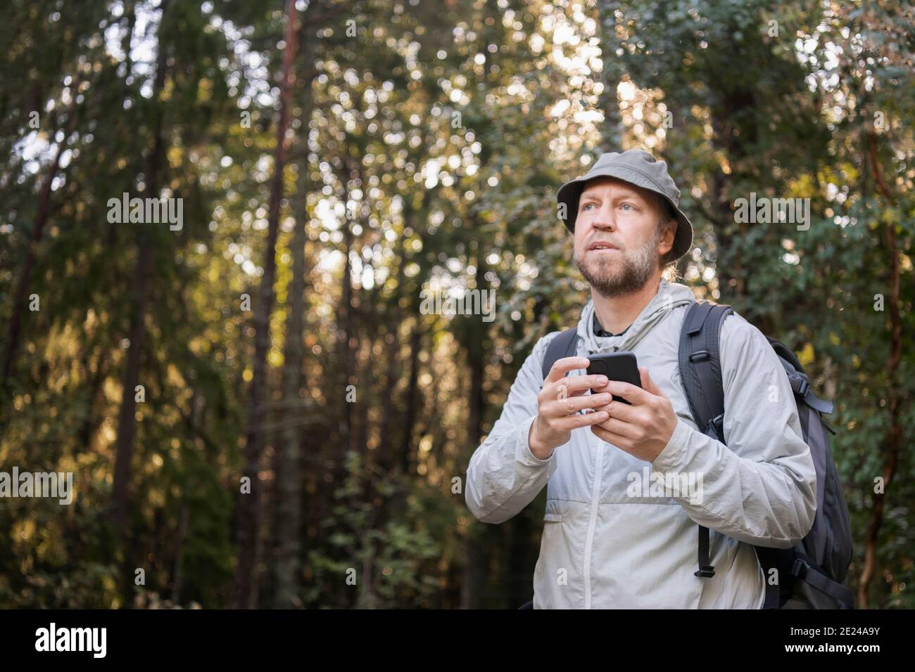 Man standing using cell hi-res stock photography and images - Alamy