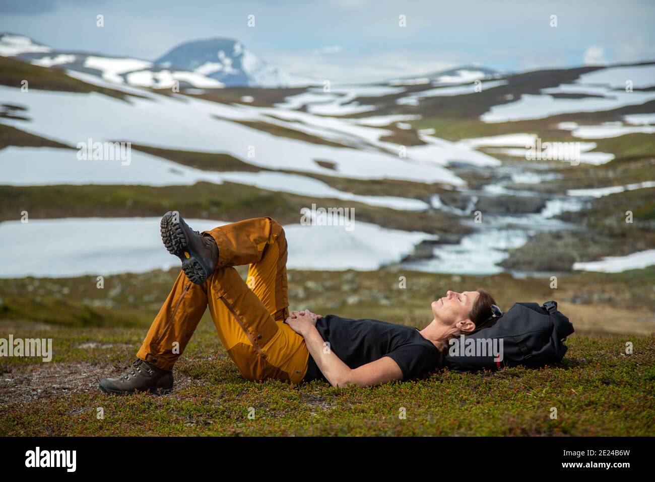 Female hiker resting Stock Photo - Alamy