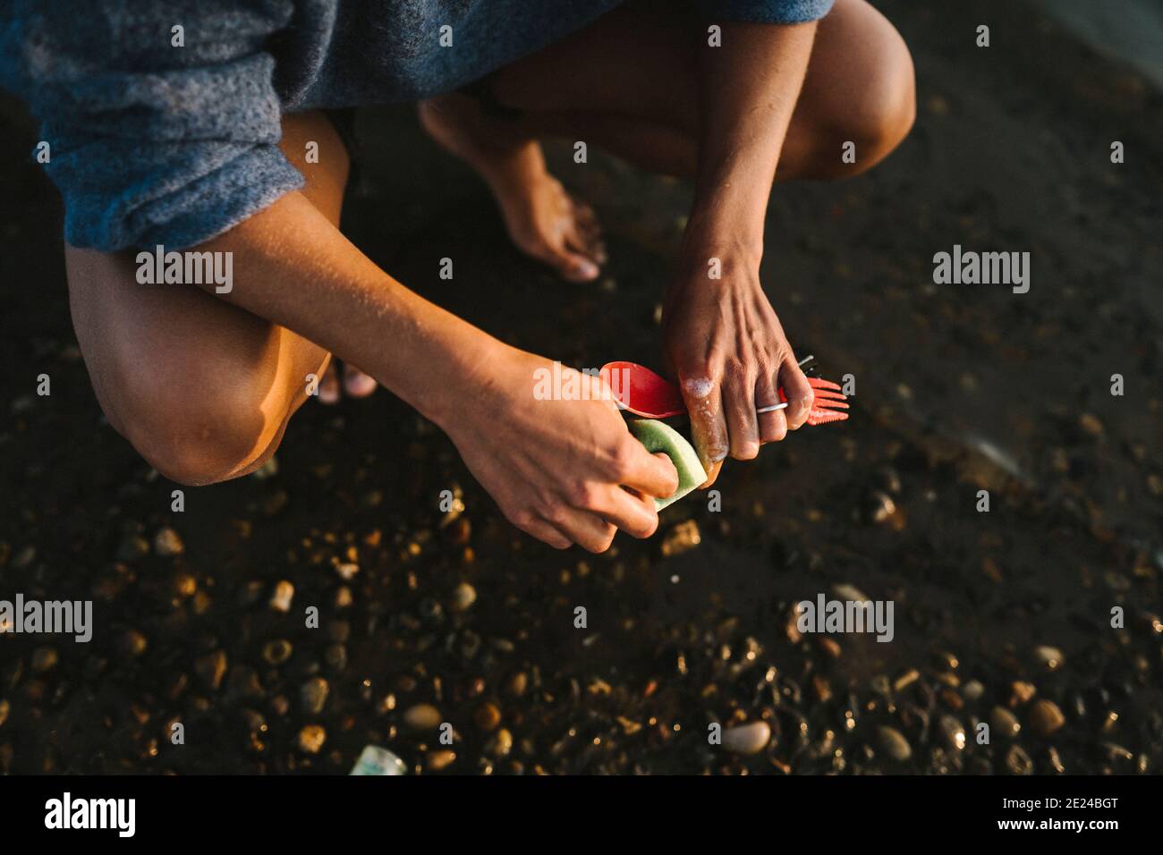 Woman washing cutlery in hi-res stock photography and images - Alamy