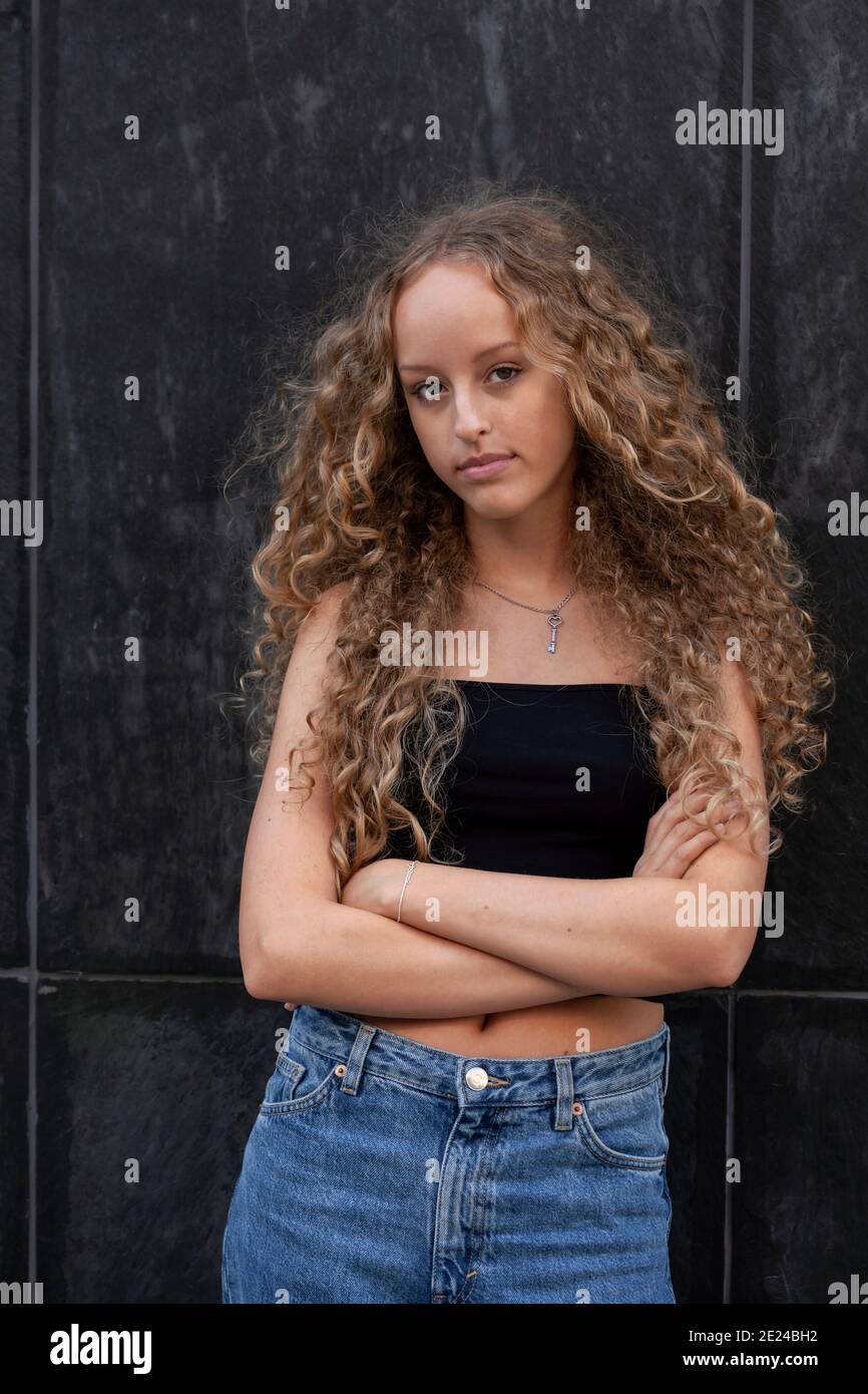 Teenage girl looking at camera Stock Photo - Alamy