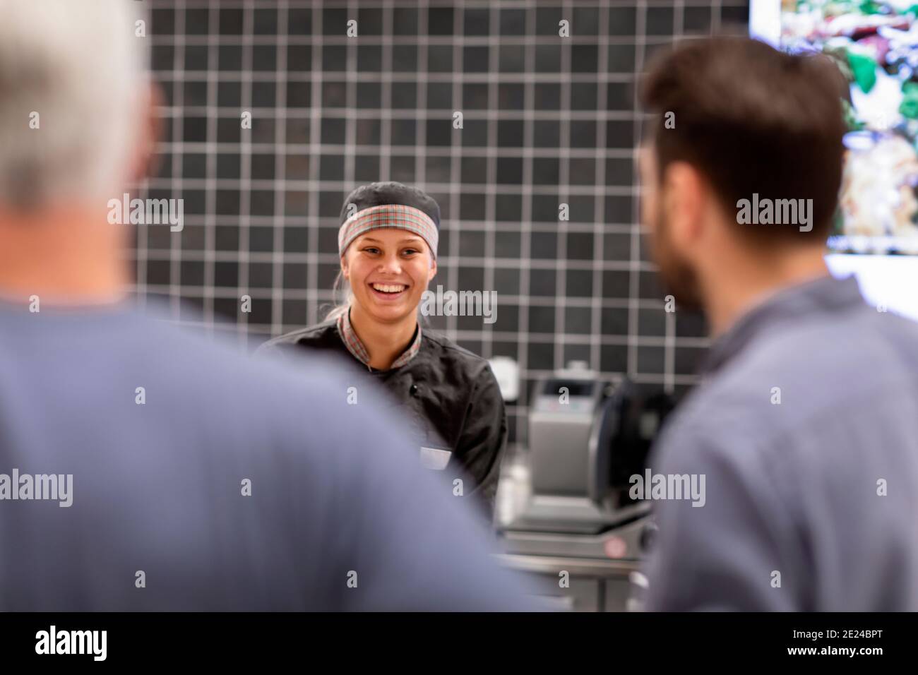Smiling at an assistant hi-res stock photography and images - Alamy