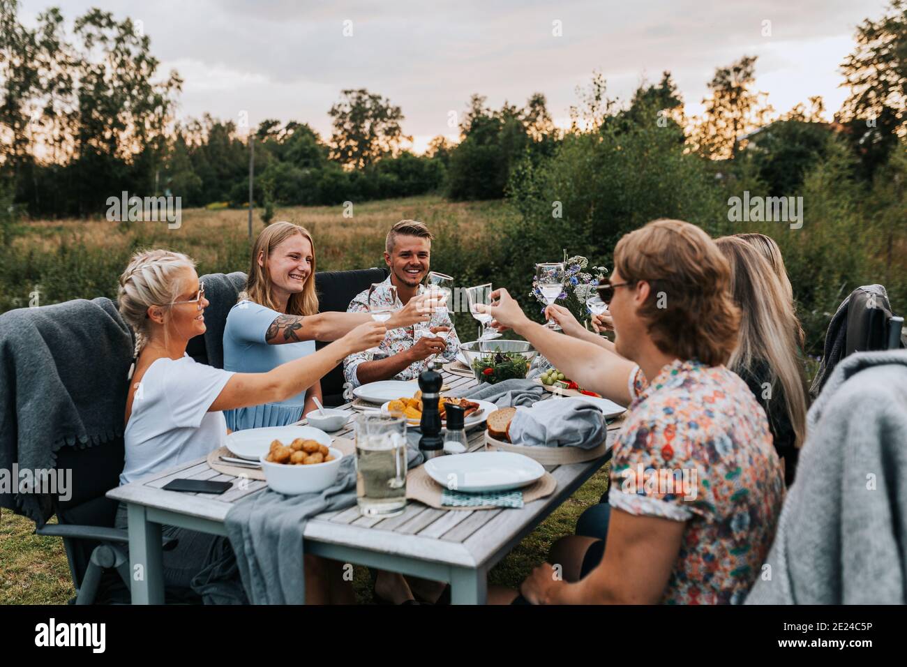 Group friends having dinner together hi-res stock photography and ...