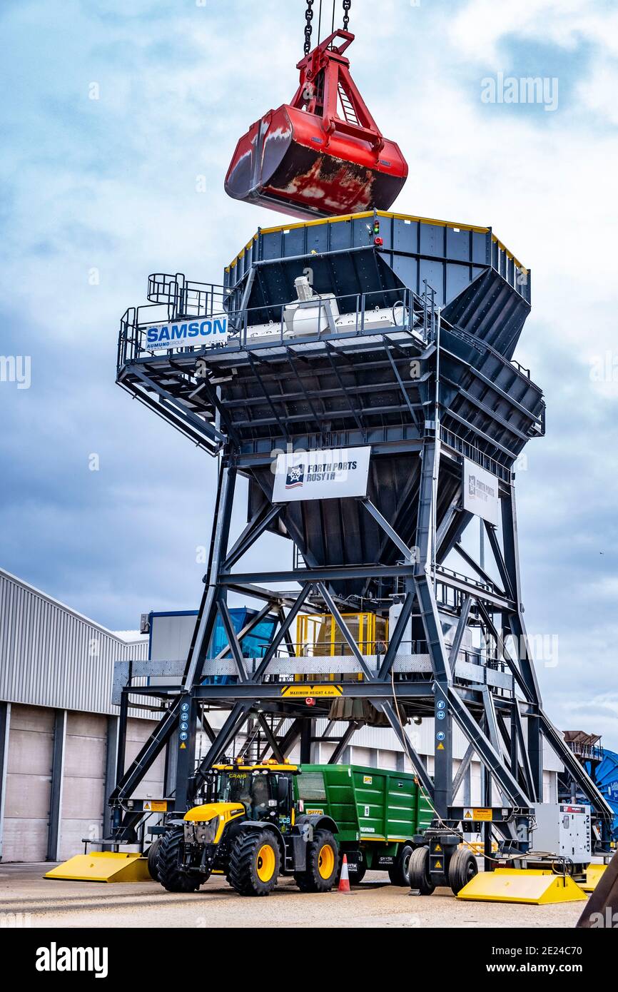 Grain being unloaded into a hopper at port Stock Photo - Alamy
