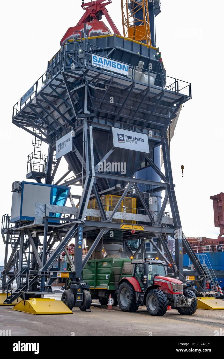 Grain being unloaded into a hopper at port Stock Photo - Alamy