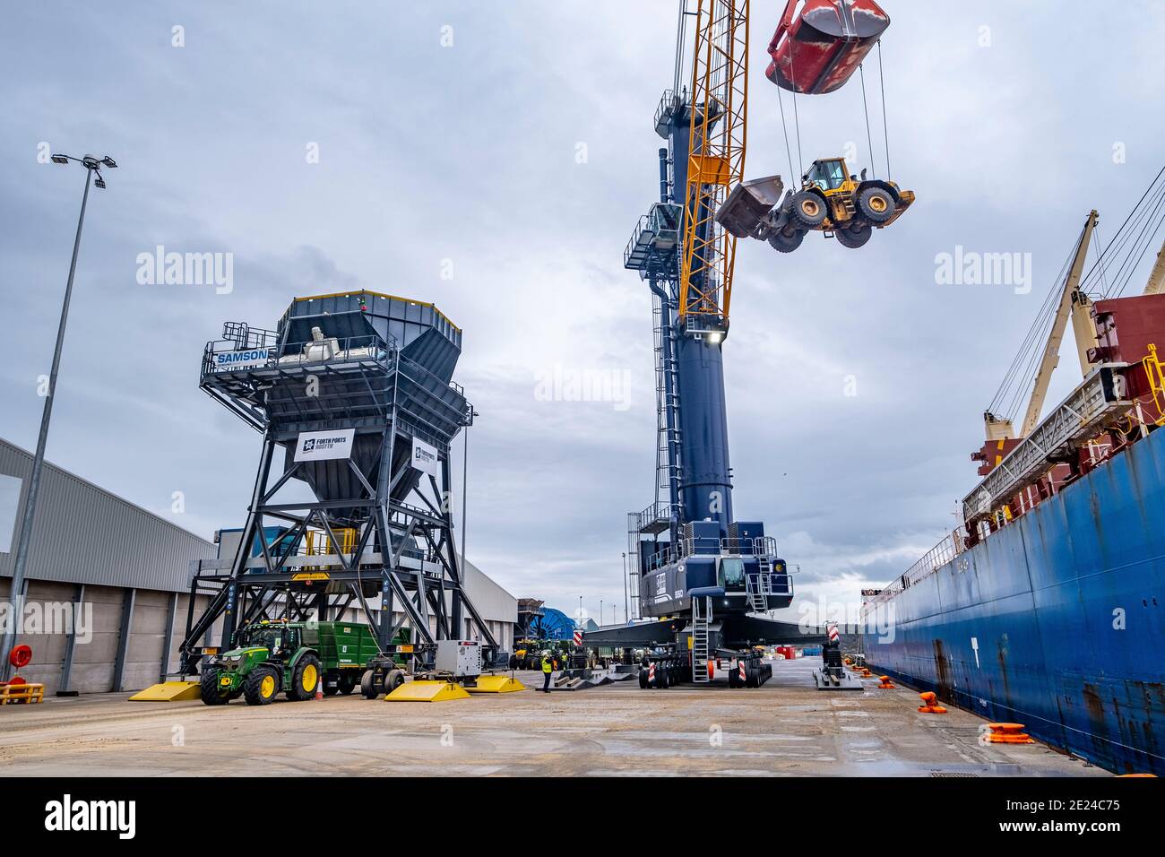 Grain being unloaded into a hopper at port Stock Photo - Alamy