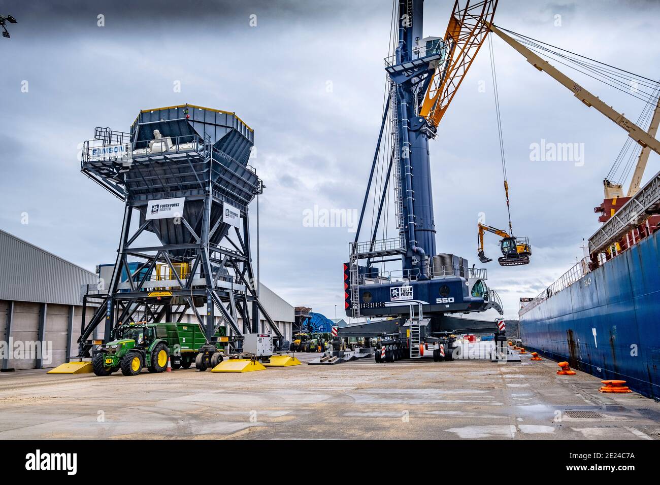 Grain being unloaded into a hopper at port Stock Photo - Alamy