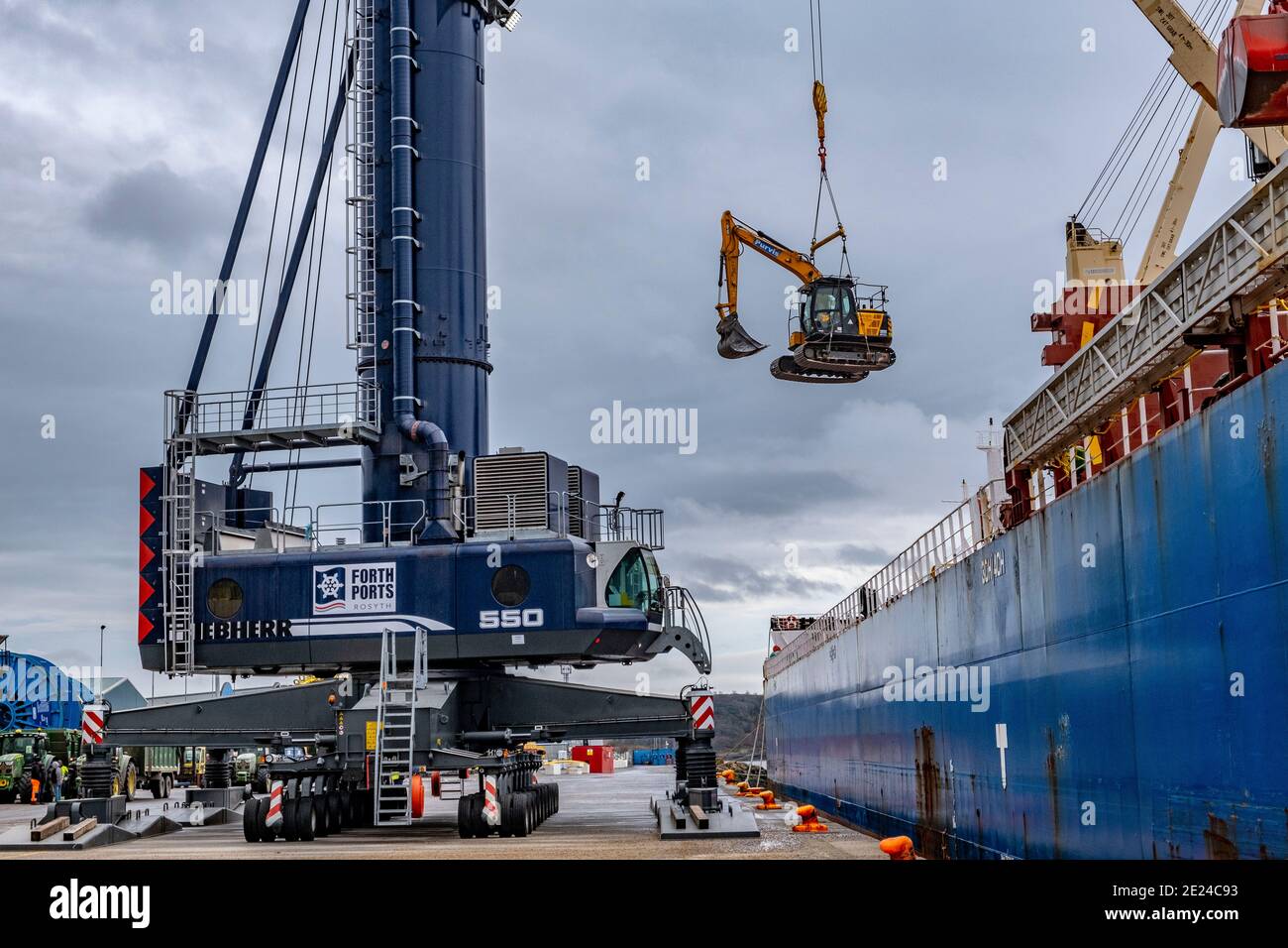 Grain being unloaded into a hopper at port Stock Photo - Alamy