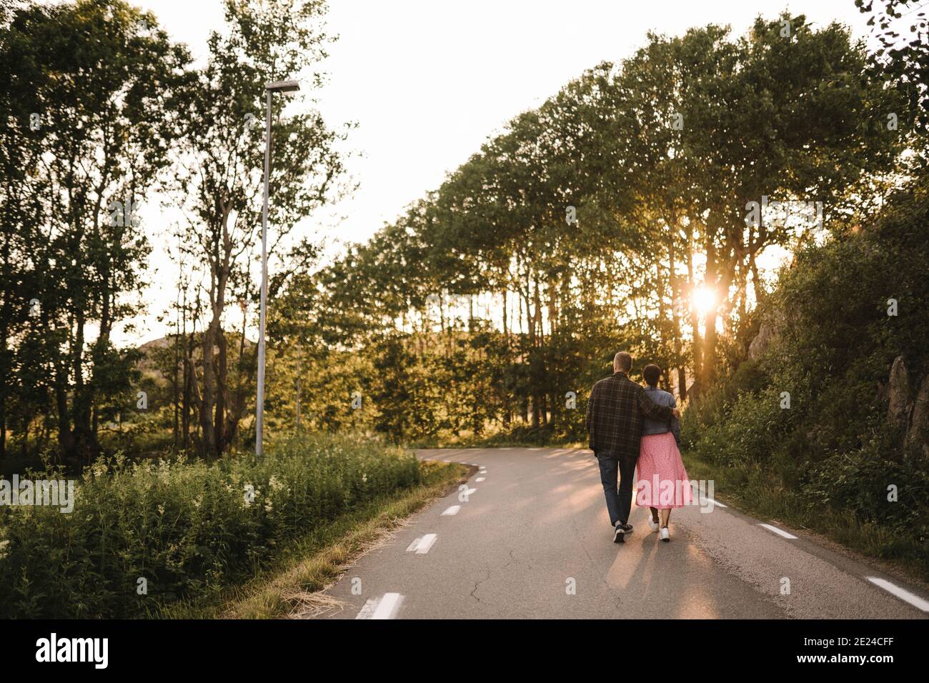 Couple walking together Stock Photo - Alamy