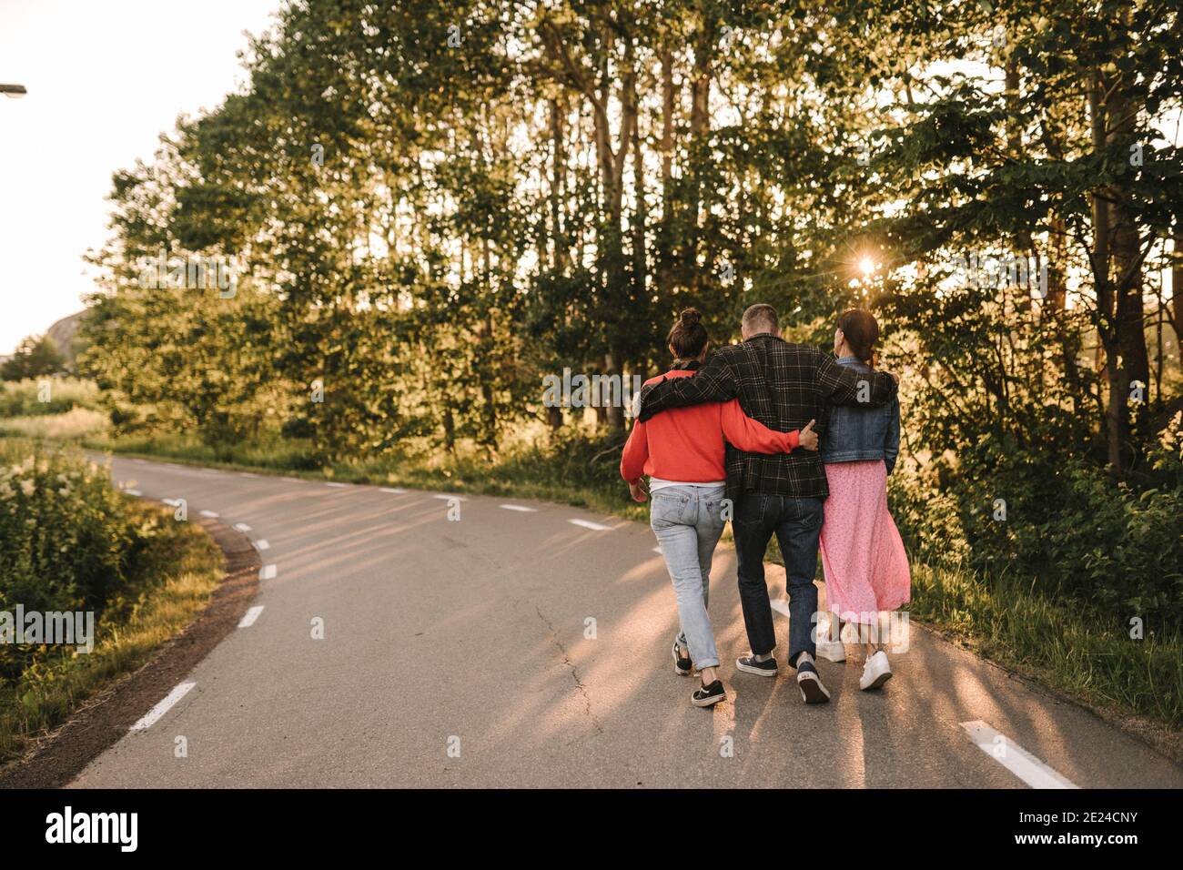 Friends walking together Stock Photo - Alamy