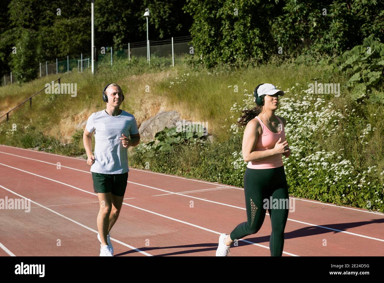 Couple jogging together Stock Photo - Alamy