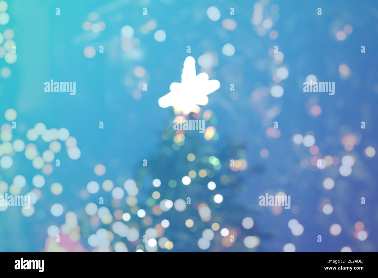 Unfocused christmas tree and blurry lights. Background for your ad ...