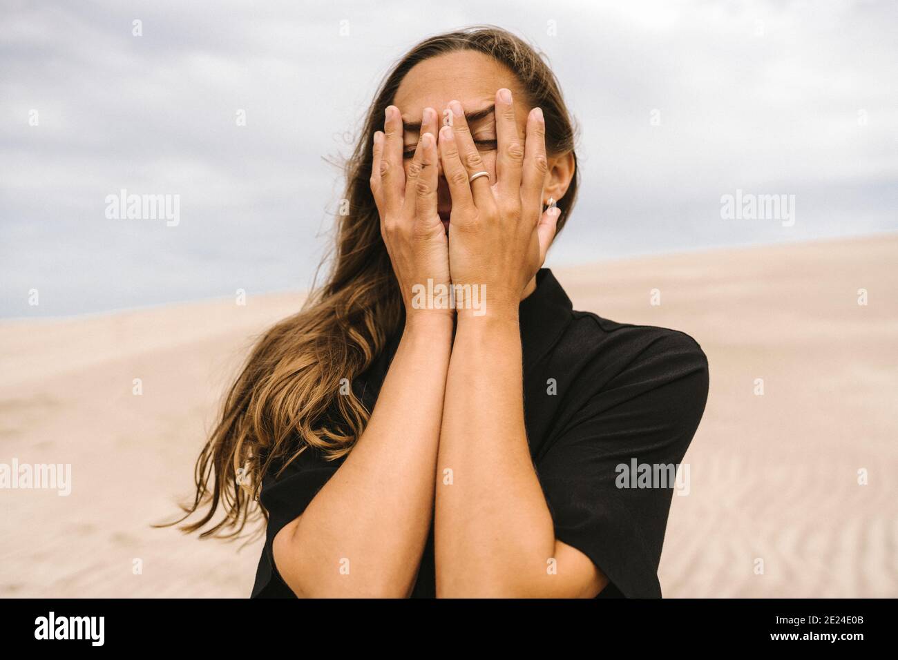 Women covering head hi-res stock photography and images - Alamy