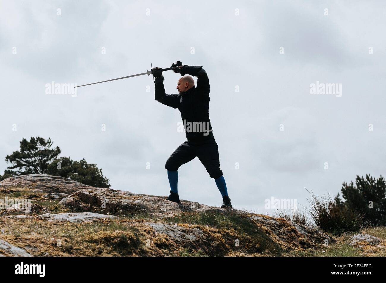 Man practicing with sword Stock Photo - Alamy