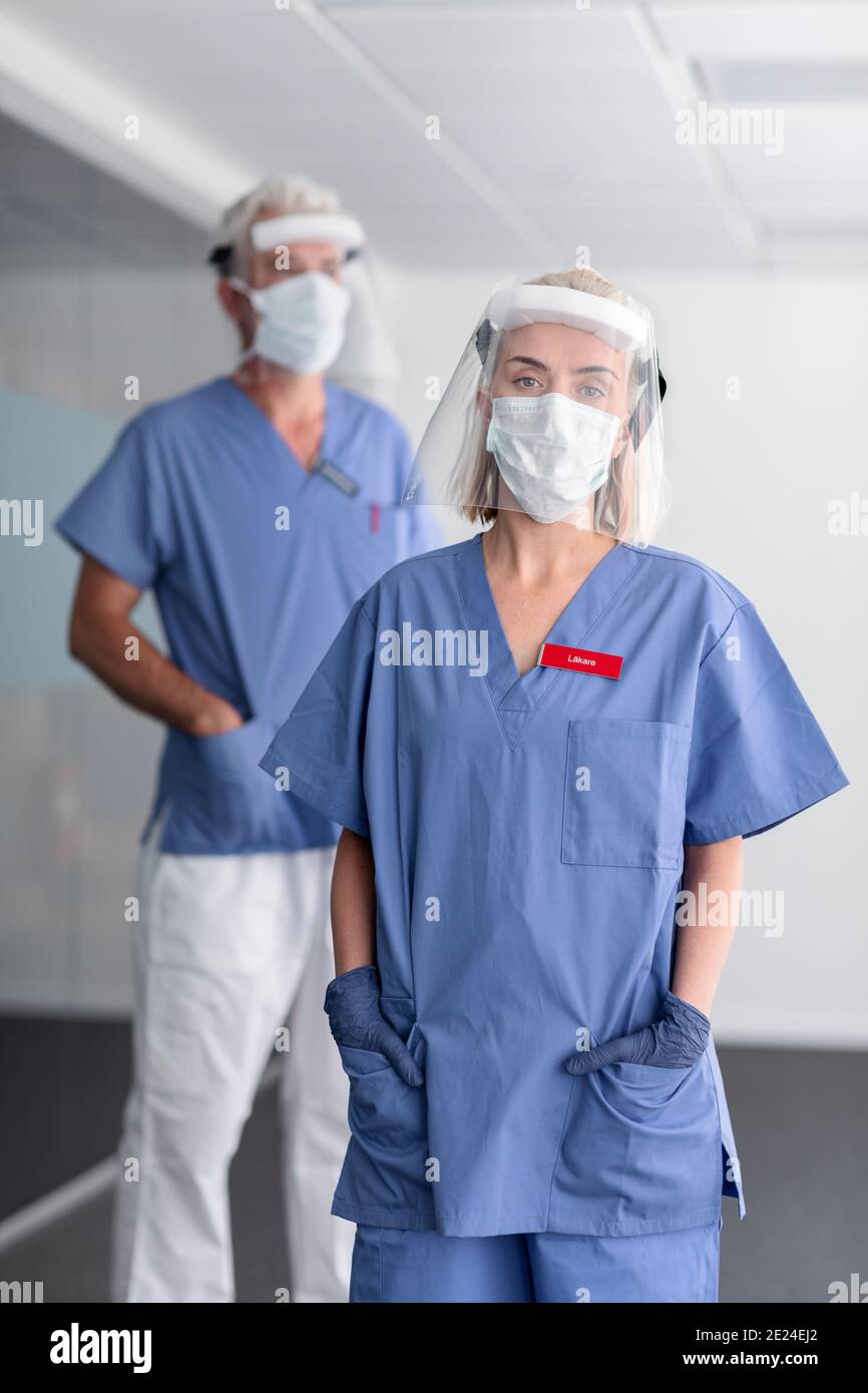 Doctors wearing face shield Stock Photo - Alamy