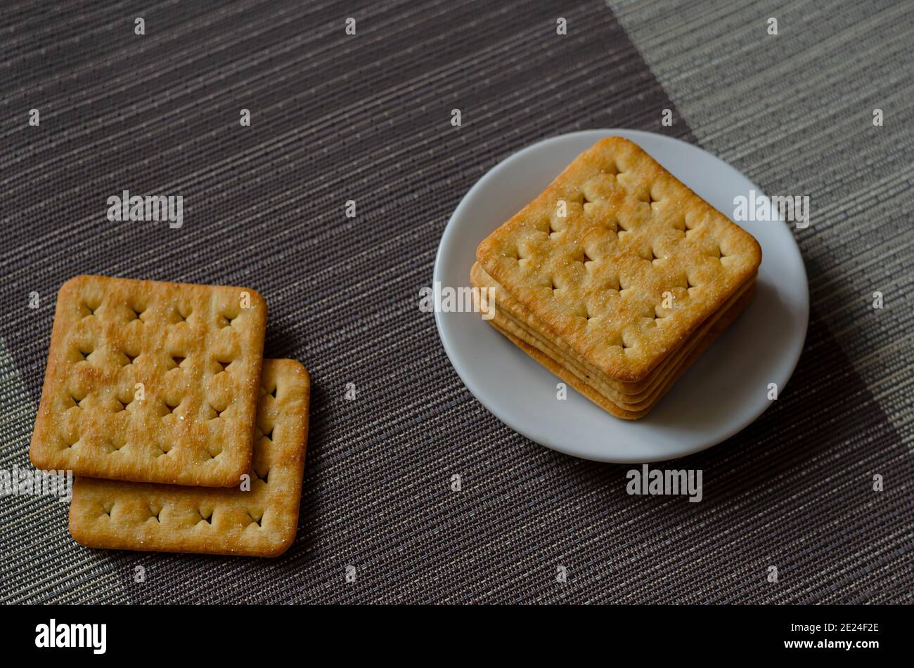 Groceries, snacks, food. Quartered saltine crispy crackers and white ...