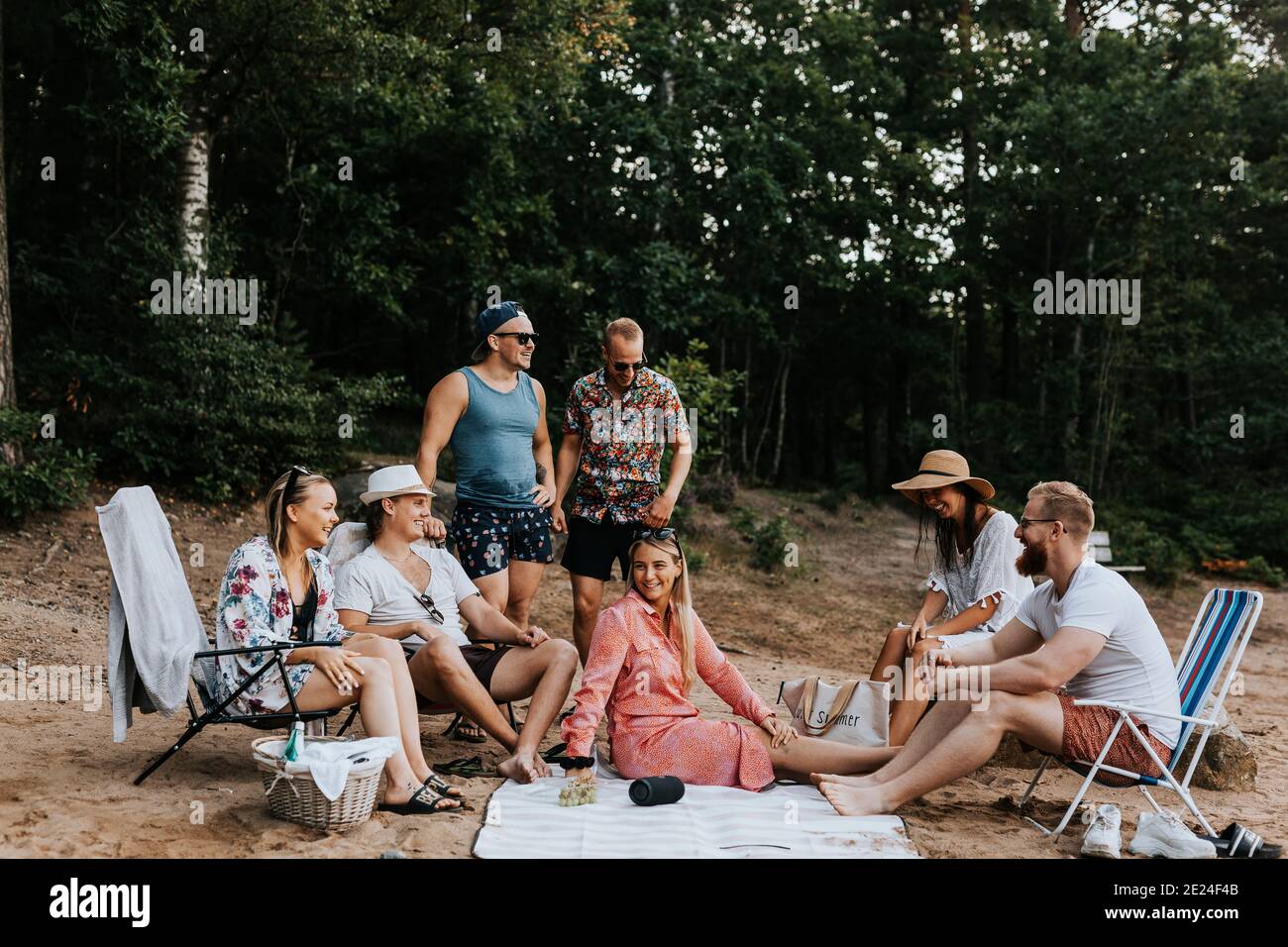 Happy friends relaxing together Stock Photo - Alamy