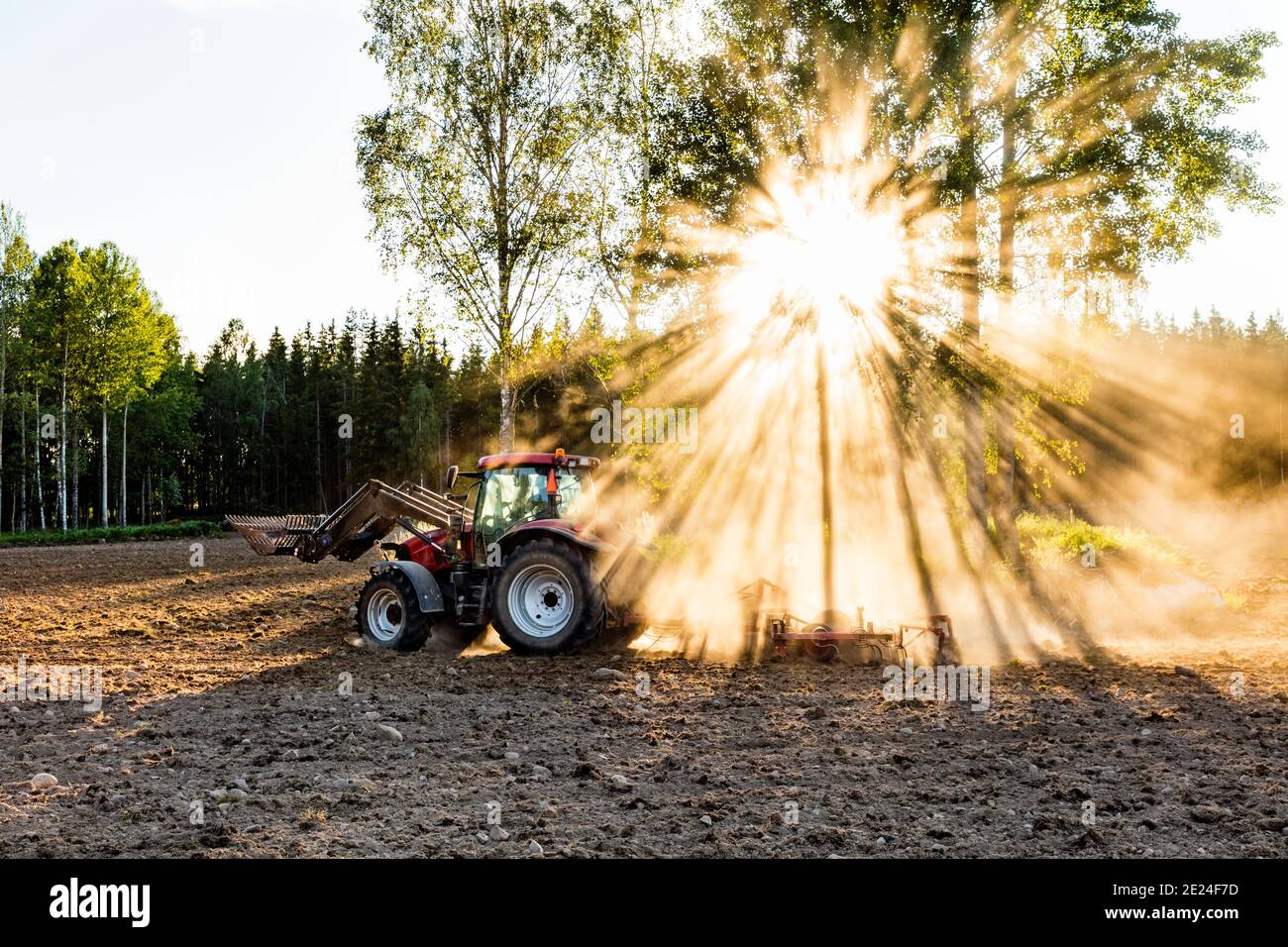 Farmer harrowing field hi-res stock photography and images - Alamy