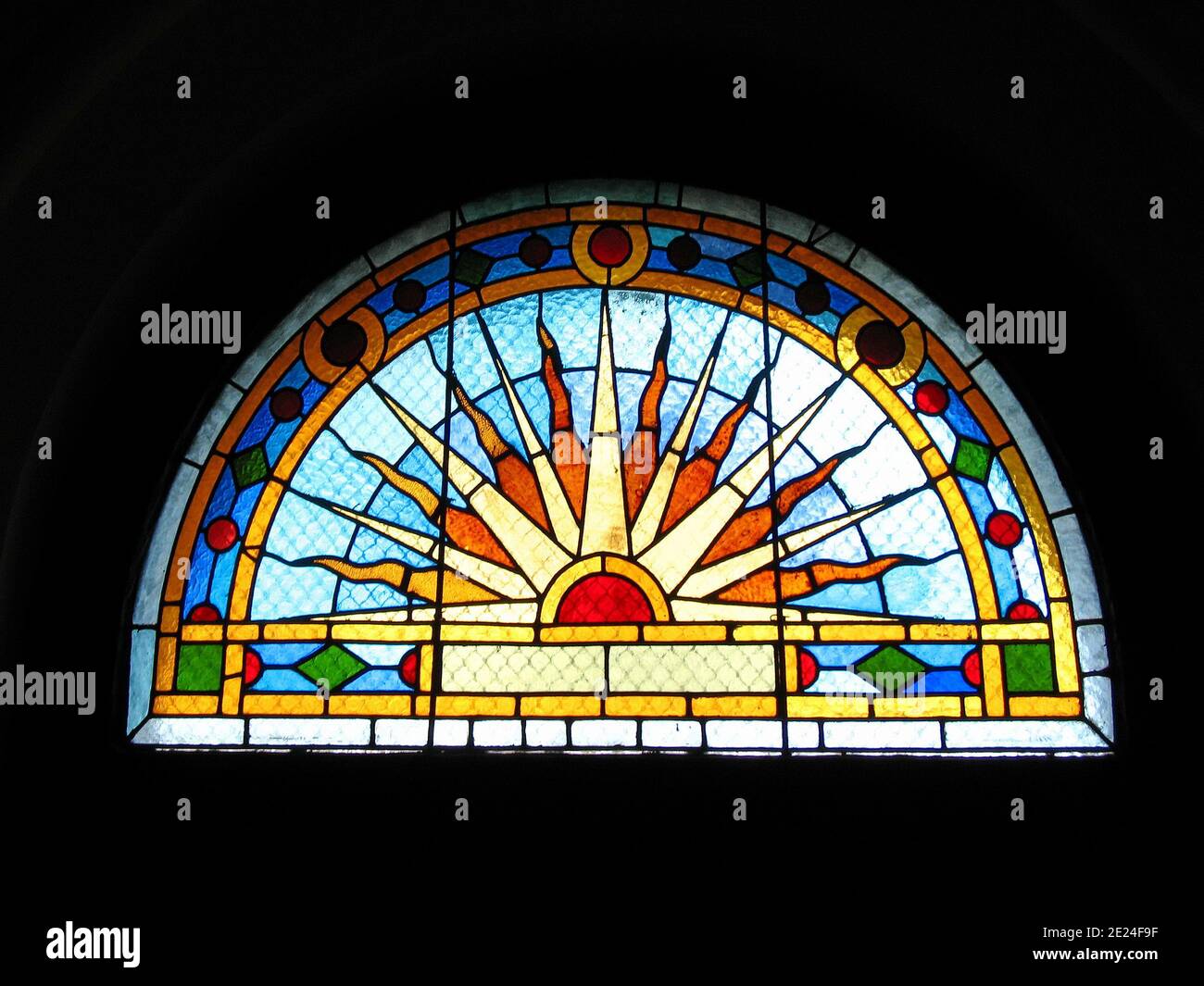 Mesmerizing shot of a bright and colorful stained glass window on the ...