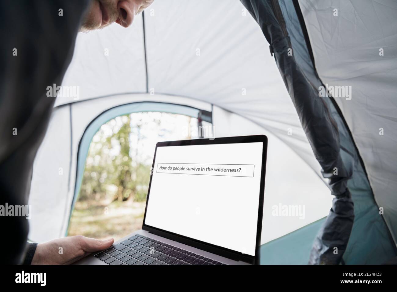 Man using laptop computer camping hi-res stock photography and images ...