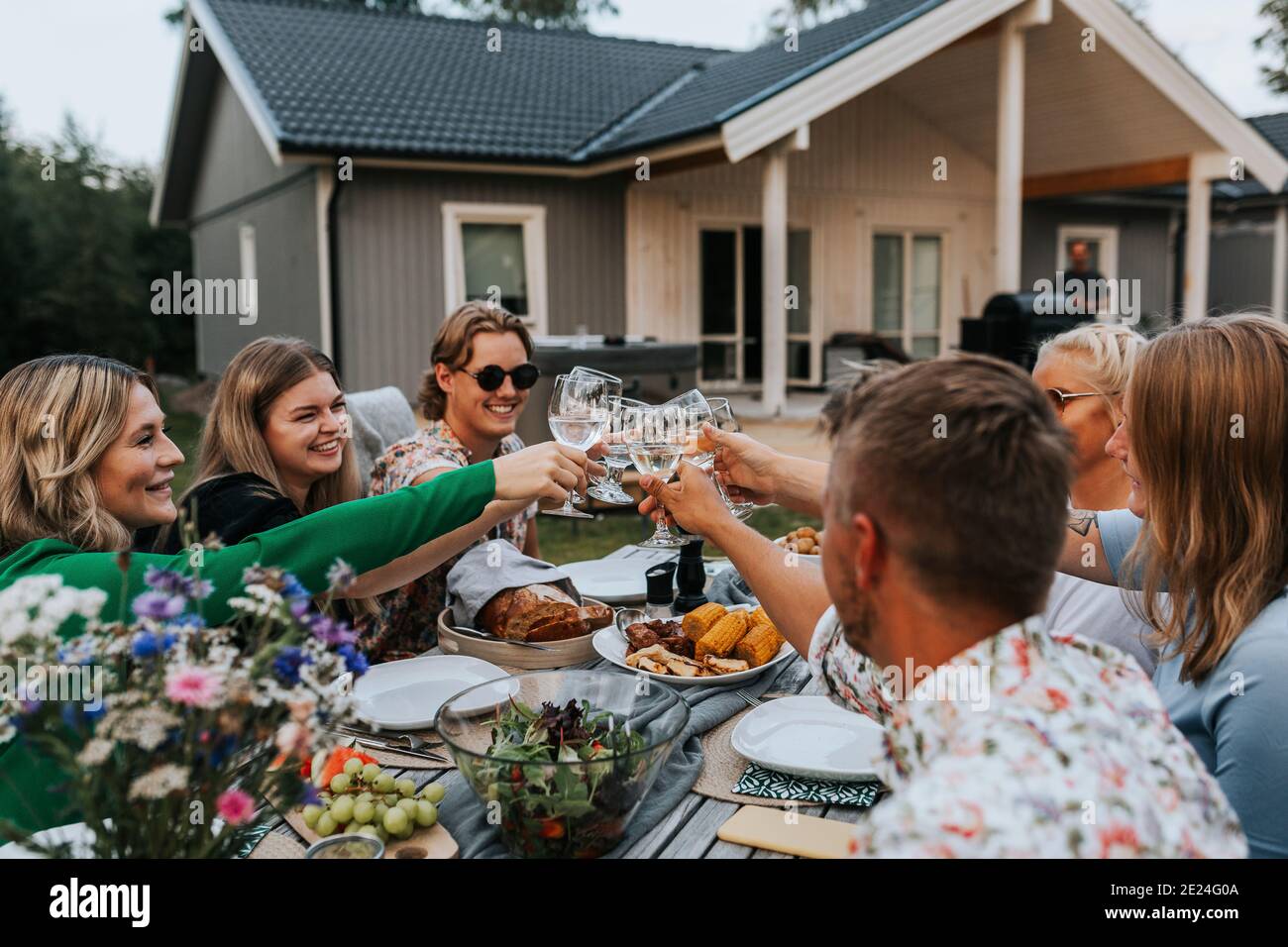 Happy friends having dinner hi-res stock photography and images - Alamy