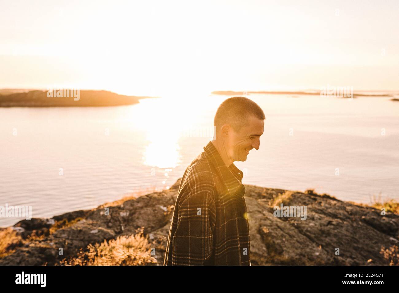 Man at sea during sunset Stock Photo - Alamy