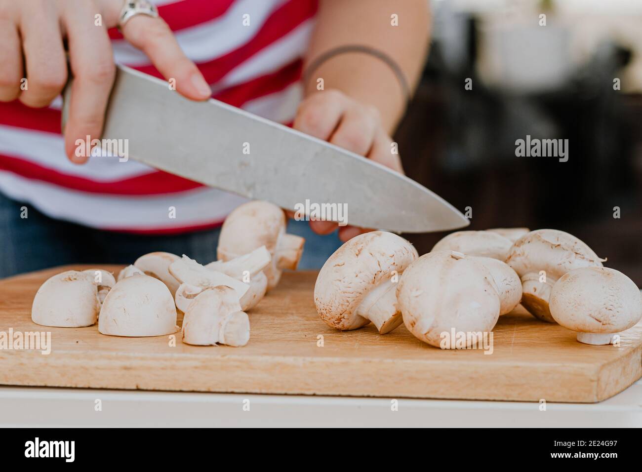 Female hands cutting fresh champignon hi-res stock photography and ...
