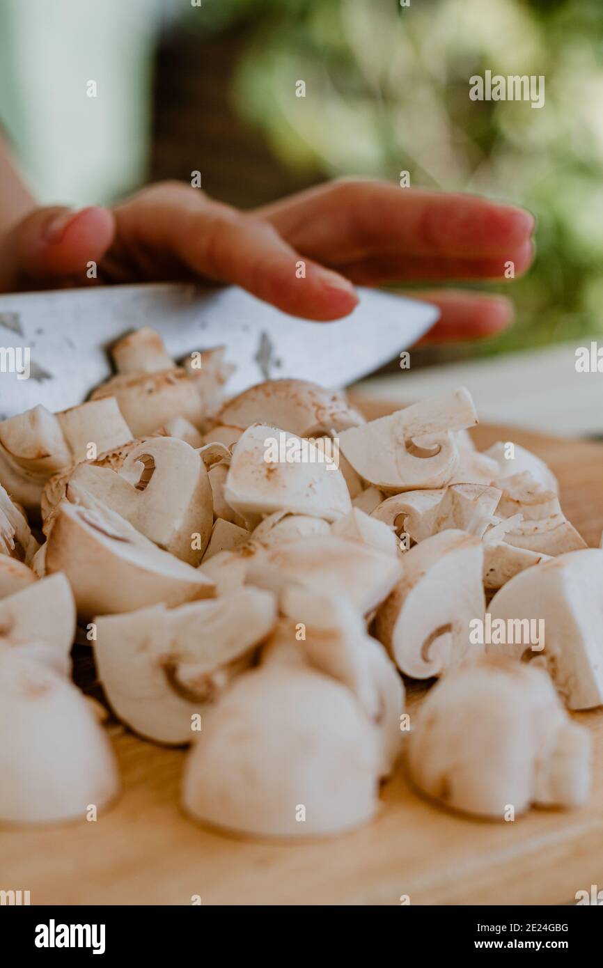 Female hands cutting fresh champignon hi-res stock photography and ...