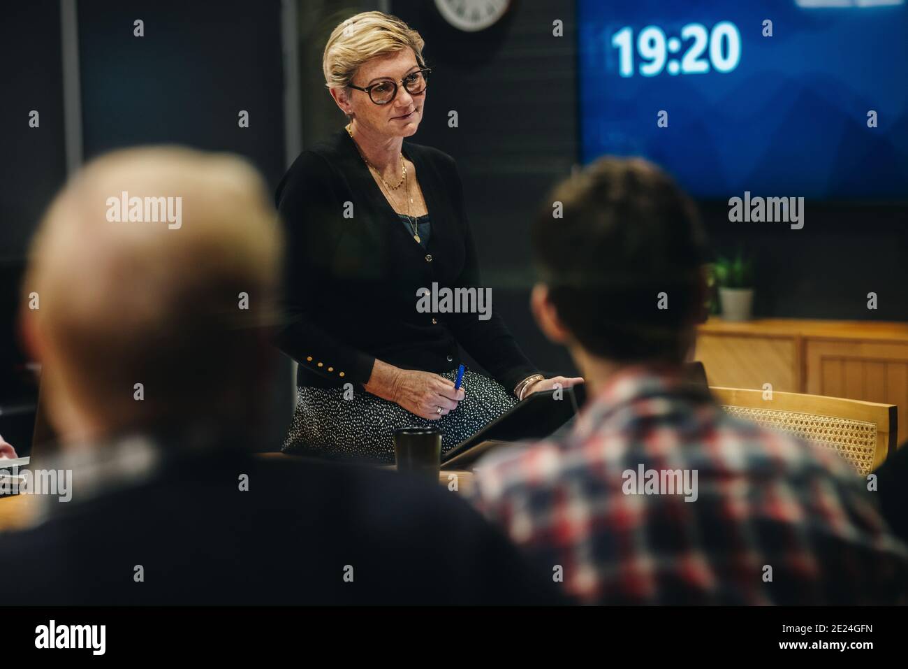 Woman addressing a meeting in office boardroom. businesswoman having a ...