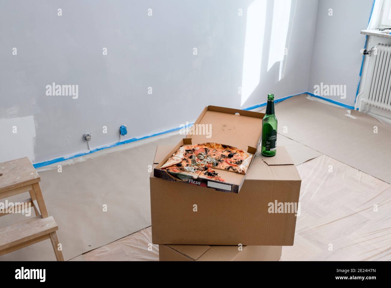 Beer bottle and pizza on top of cardboard boxes Stock Photo - Alamy