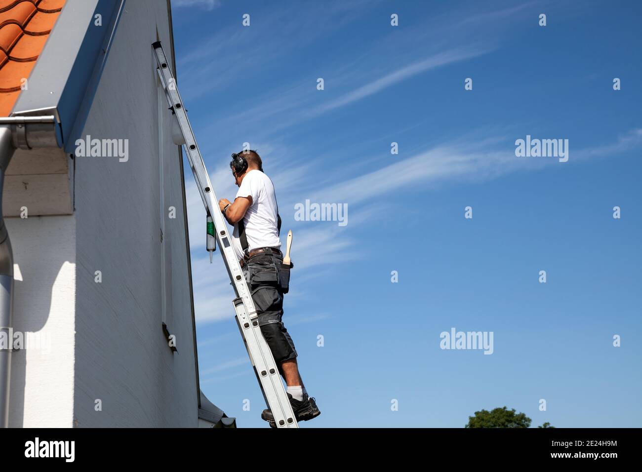 Man at top of ladder hi-res stock photography and images - Alamy