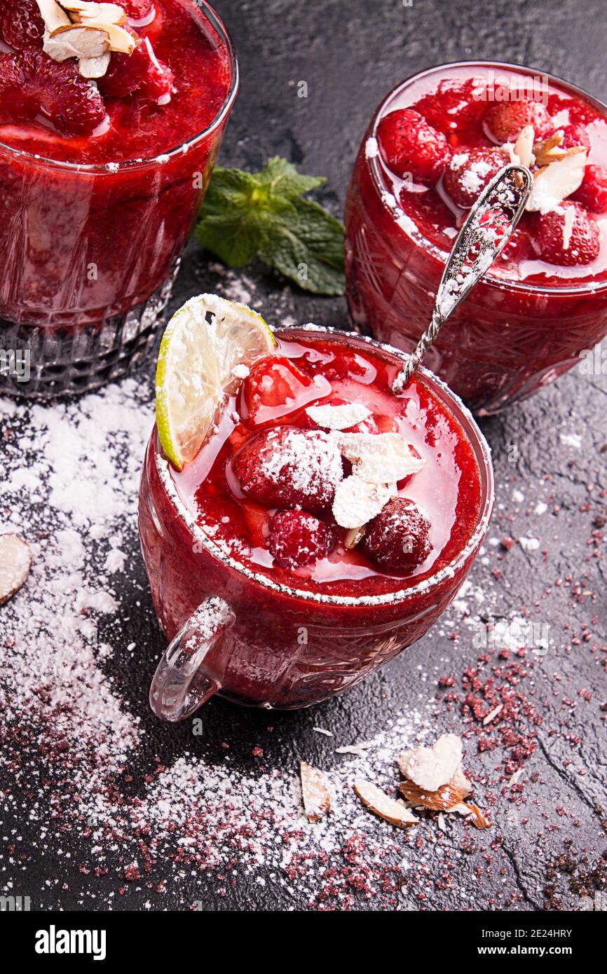 Blended strawberry shake smoothie with whole strawberries, ice and ...