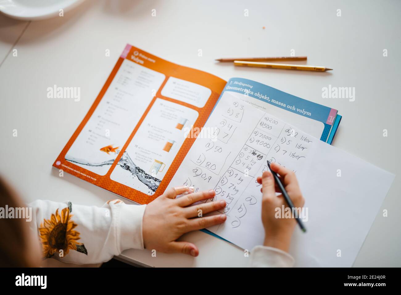 Girl doing math Stock Photo - Alamy