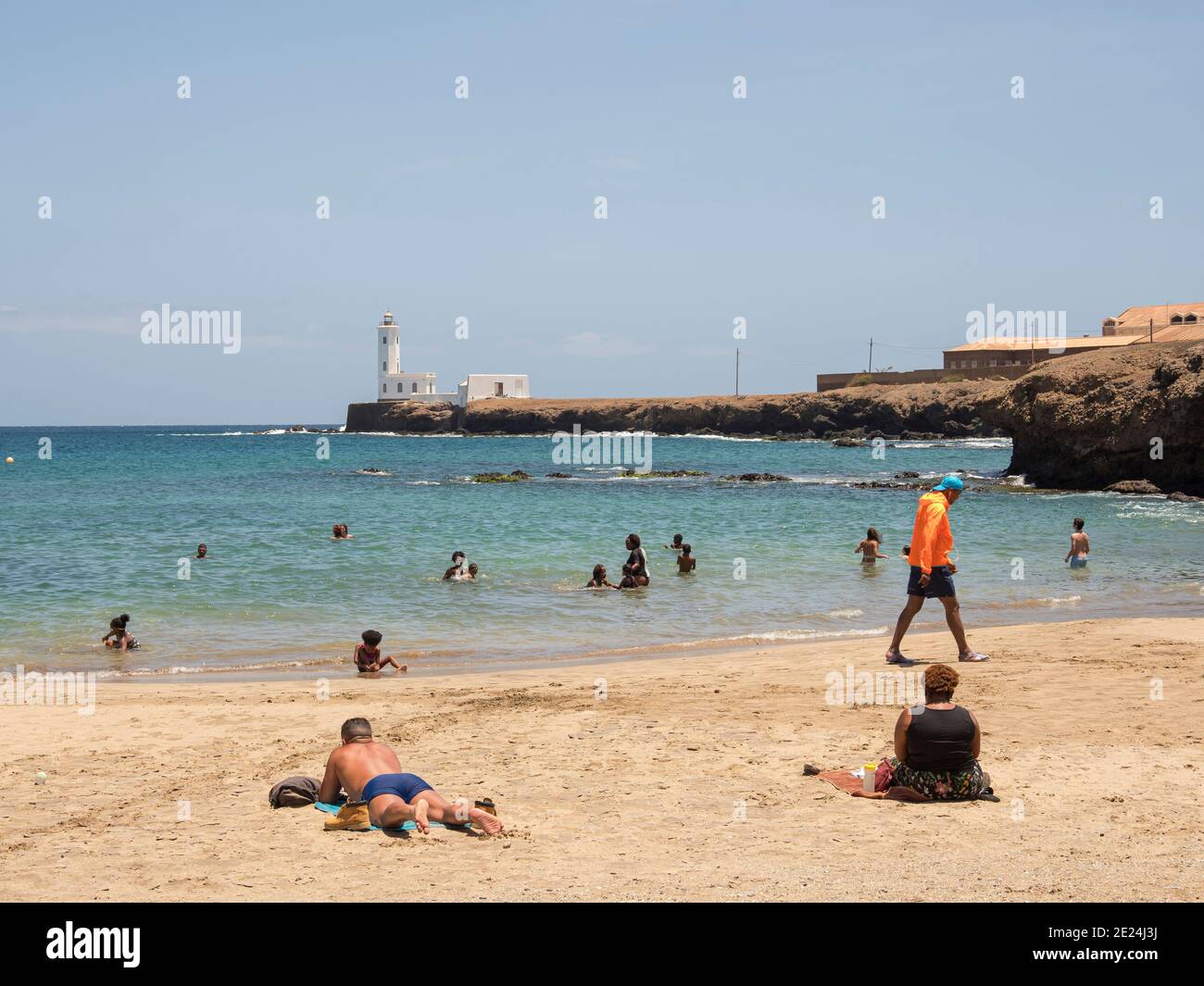The busy beach at Prainha. The capital Praia on the island of Santiago ...
