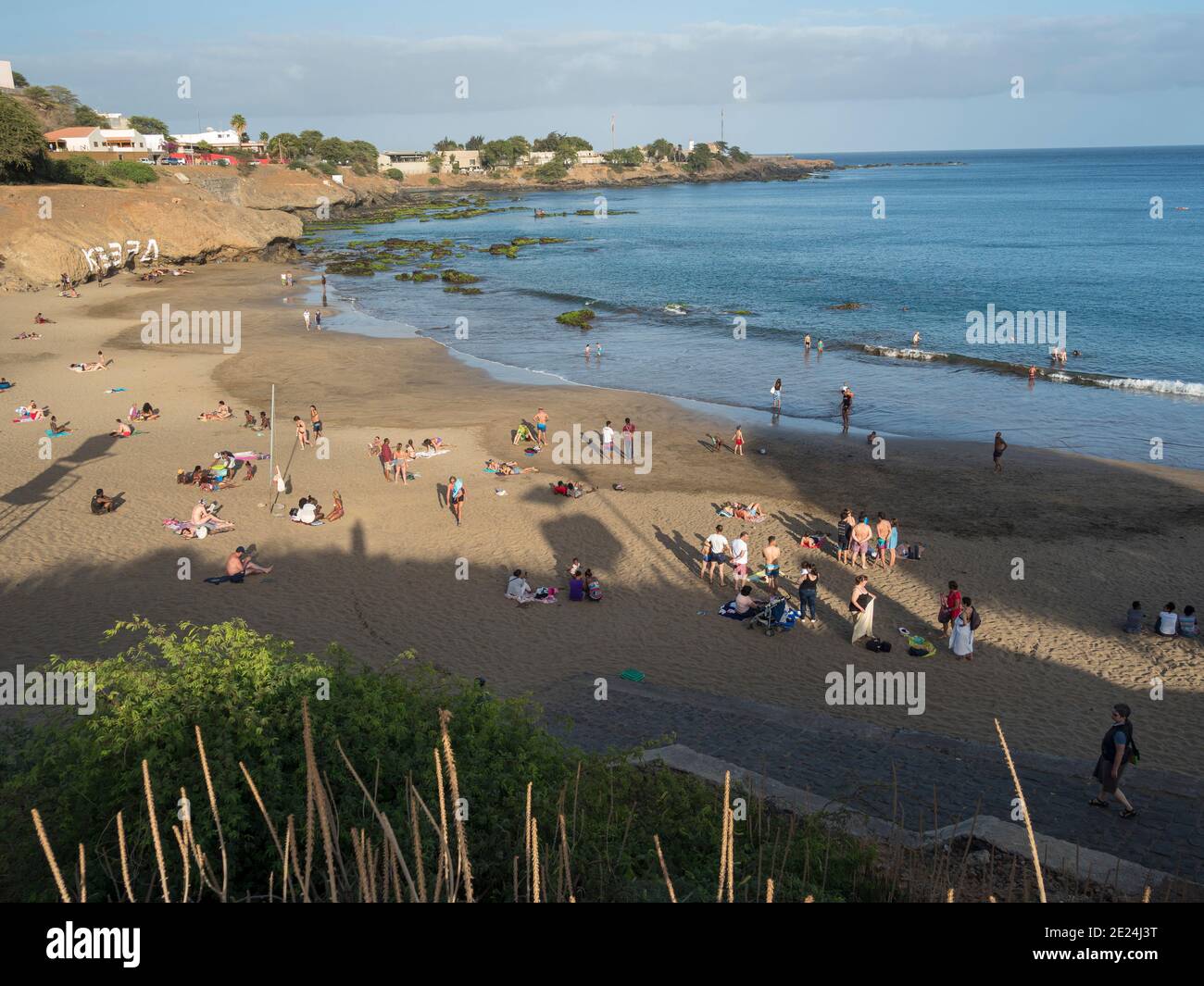 The busy beach at Prainha. The capital Praia on the island of Santiago ...