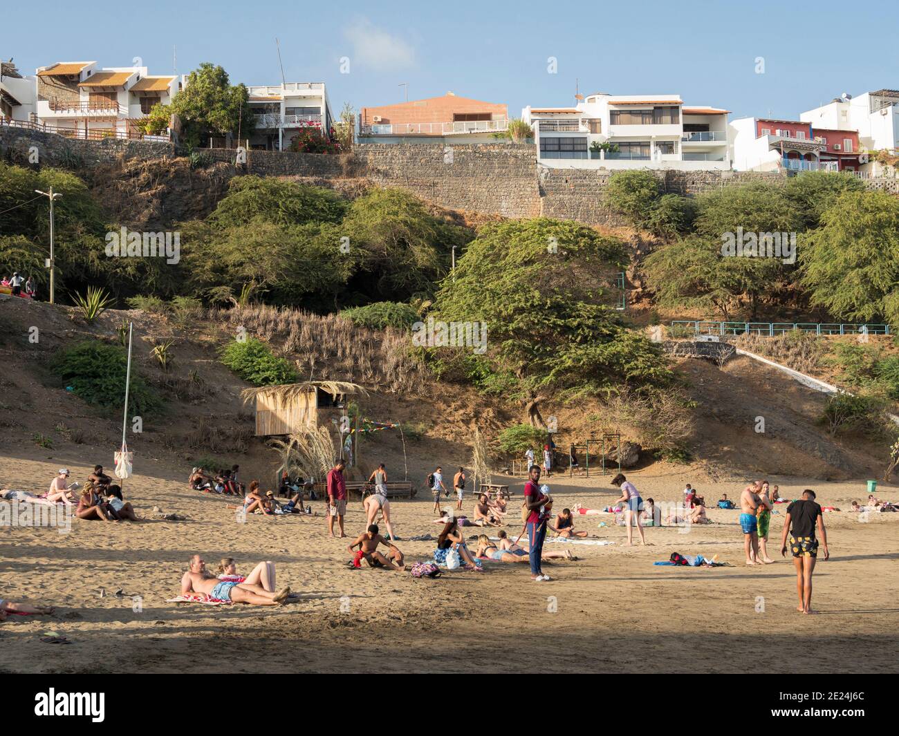 The busy beach at Prainha. The capital Praia on the island of Santiago ...