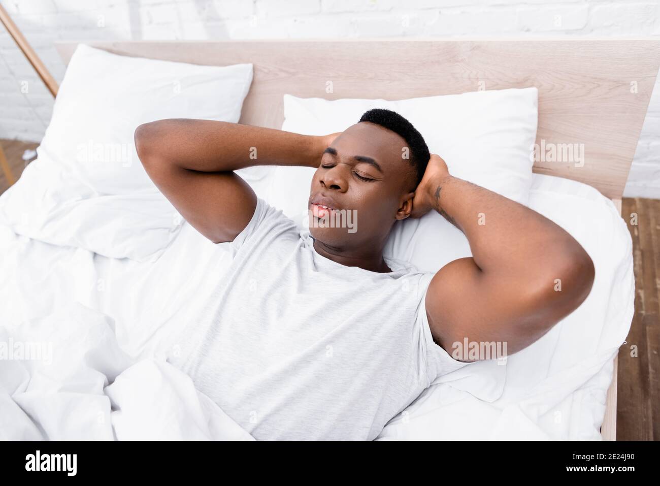 Man hands head bed hi-res stock photography and images - Alamy