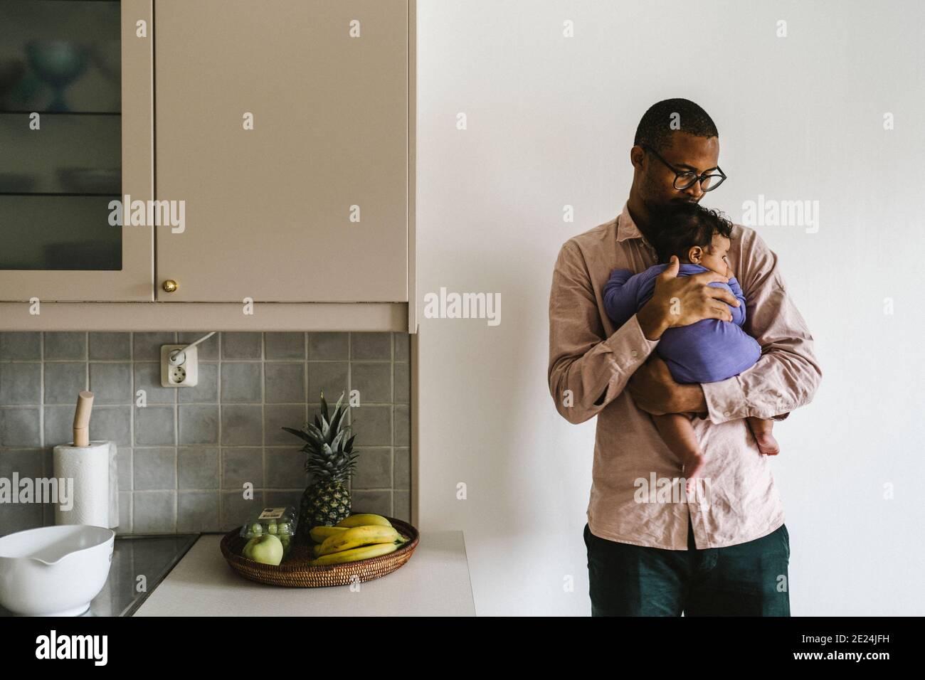 Father carrying baby Stock Photo - Alamy
