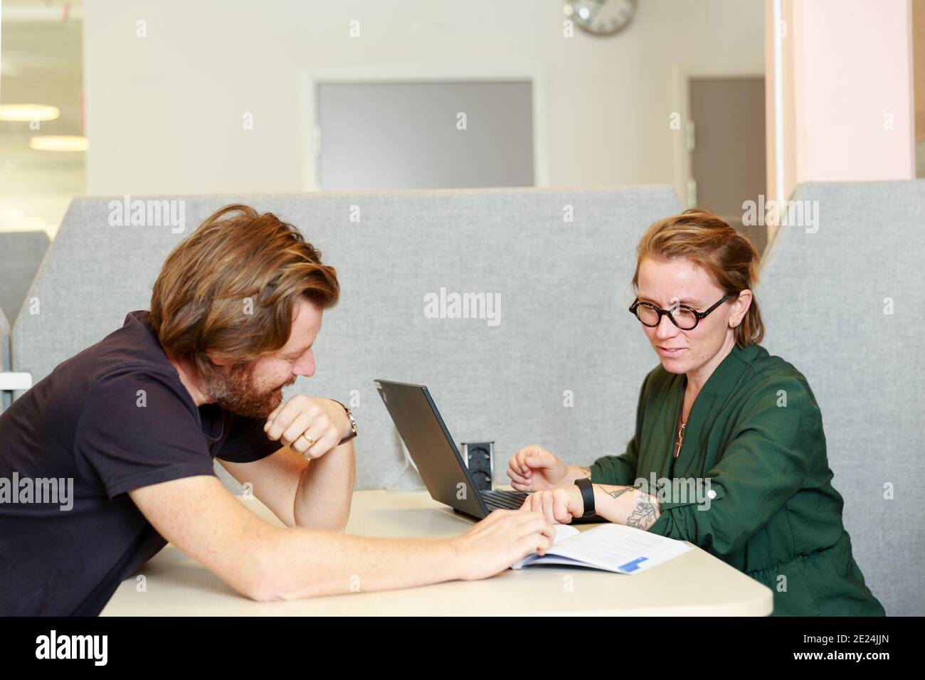 Coworkers talking at work Stock Photo - Alamy