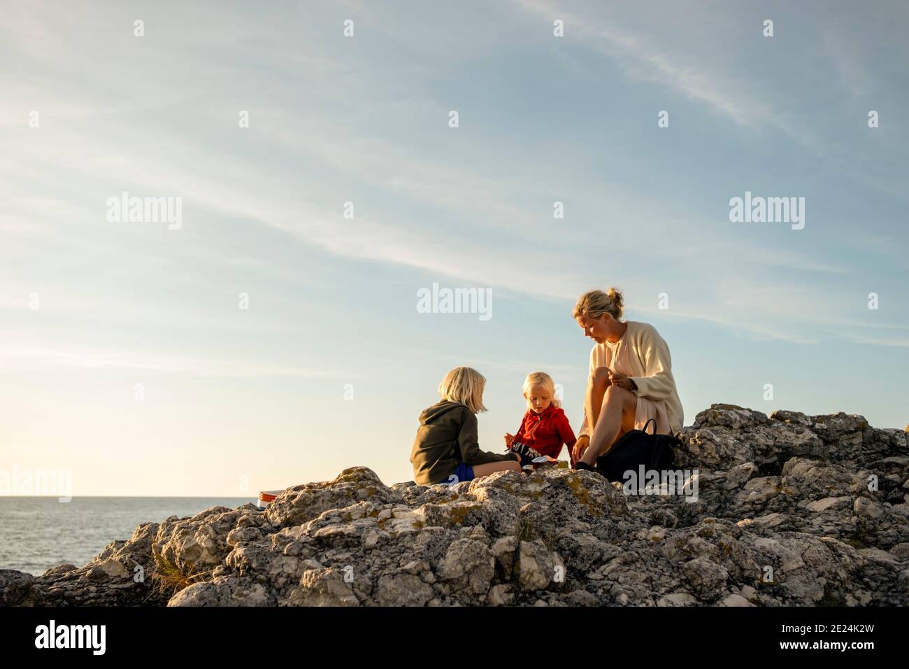 Mother daughters sitting outdoors hi-res stock photography and images ...