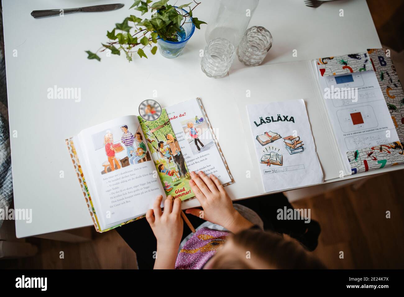 High angle of girl reading book Stock Photo - Alamy